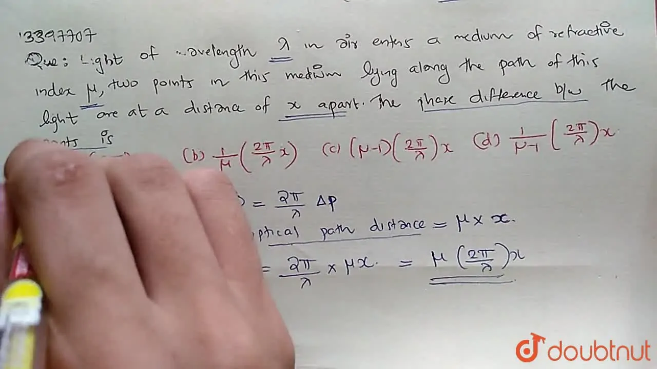 Light of wavelength lambda in air enters a medium of refractive index